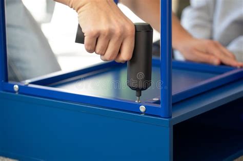 Diy Furniture Assembly At Home With Cordless Drill In Modern Living Room Instructions Stock