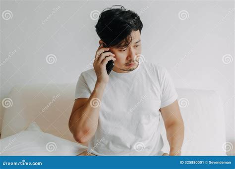 sad man trying to call and connect to someone but no answer stock