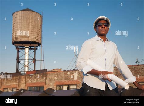 Black Architect Standing On Rooftop Stock Photo Alamy