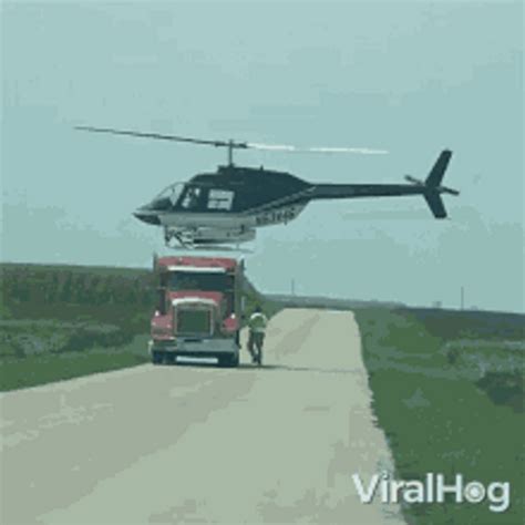 Helicopter Landing Top Of Truck Middle Of Road 