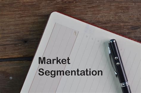premium photo pen and notebook written with text market segmentation