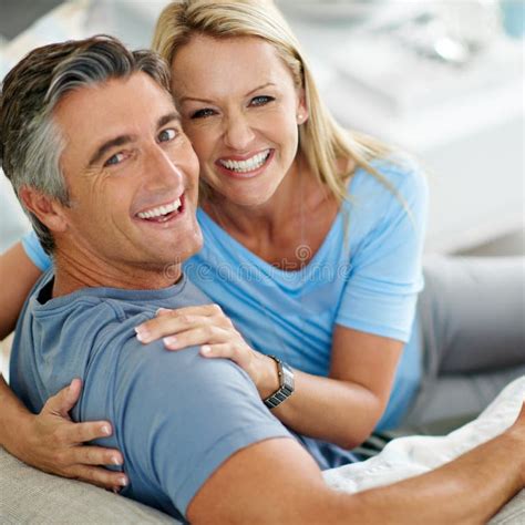 Relax Hug And Portrait With Mature Couple On Sofa For Romance Smile