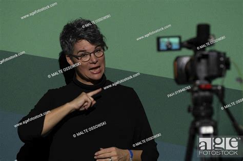 A Sign Language Interpreter For The Deaf Translates The Spoken Word