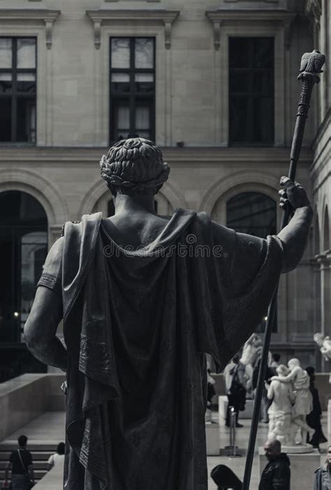 Roman Emperor Who Looks Towards The Crowd And Holds A Scepter In His Right Hand Editorial