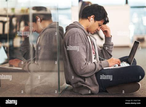 Young Indian Software Developer Man Using Laptop Computer Writing Programming Code While Sitting