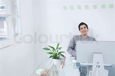 Man Laughing At Computer Stock Image Colourbox