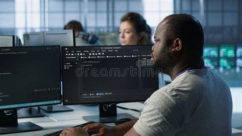 Admin In Server Hub Tasked With Protecting Valuable Data Against Hacking Attacks Stock Image