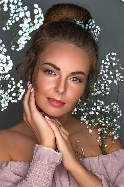 Premium Photo Portrait Of A Smiling Beautiful Sweet Girl On A Gray