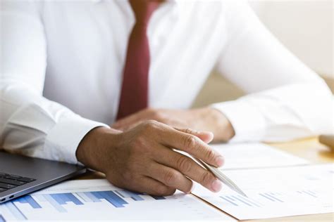 Premium Photo Businessmen Are Working On Calculating Statistics From