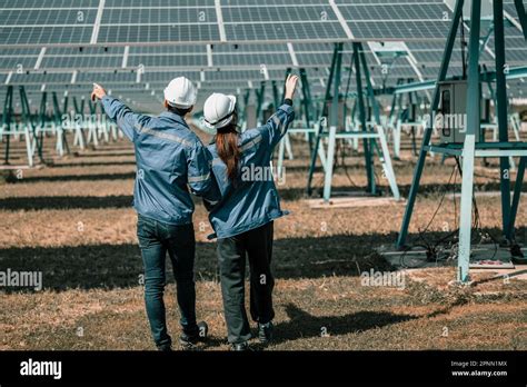 Solar Design Engineers Visually Inspect Photovoltaic Array Installation Sites For Suitable