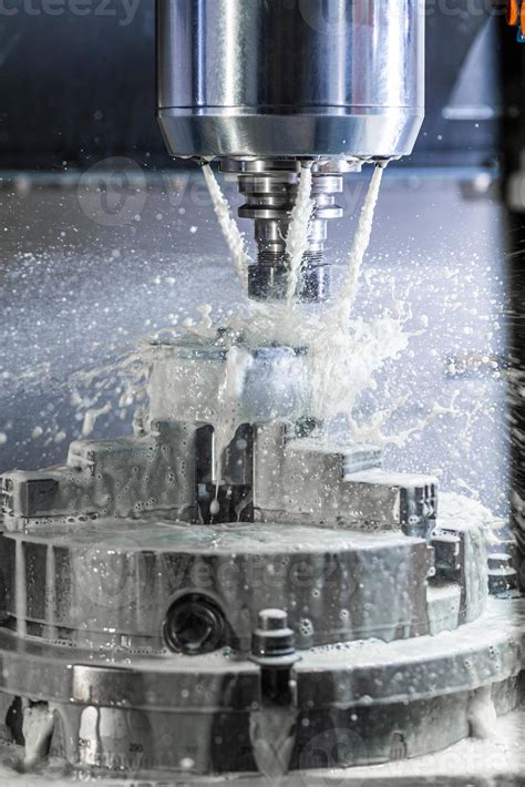 Vertical Photo Of Industrial Wet Milling Process In 5 Axis Cnc Machine With Coolant Flow Under