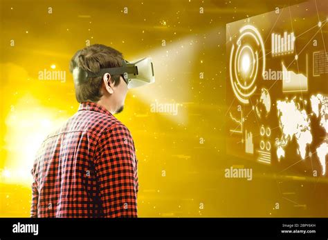 rear view of asian man looking at digital interface with virtual