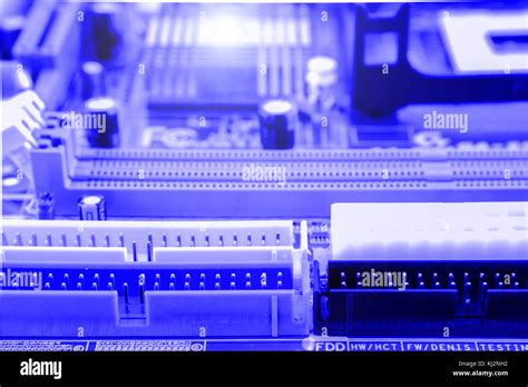 Electronics Components On Modern PC Computer Motherboard With RAM Connector Slot And CPU Socket