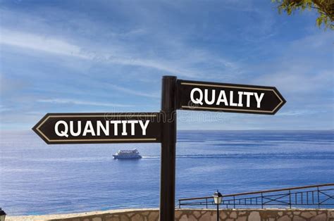 Quantity Or Quality Symbol Concept Word Quantity Or Quality On Beautiful Signpost With Two