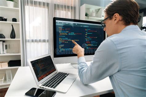 It Developer Pointing On Coding Software On Pc Comparing Laptop Pecuniary Stock Image Image
