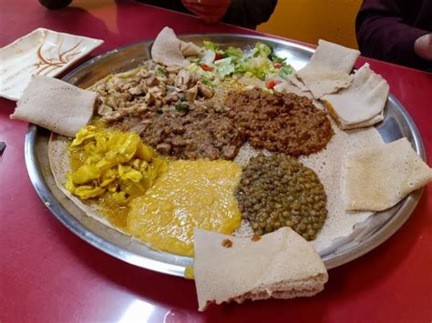 Plate With Yebeg Alecha Doro Tibs And Bozena Shiro To Share R Ethiopianfood