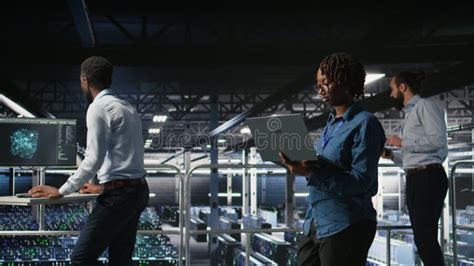 Data Center Software Developers Using Devices To Review Ai Llm Visualizations Stock Video