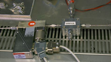Parts Of The Test Setup Showing The Flow Sensor And Orifice Fixture Download Scientific
