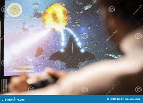 Man In Living Room Playing Science Fiction Videogame On Gaming Console