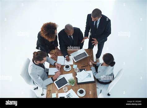 The Whole Is Greater Than The Sum Of The Parts High Angle Shot Of A Group Of Businesspeople