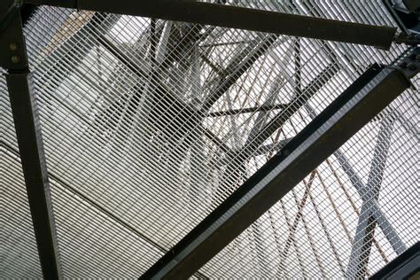 new modern tall metal construction observation tower with steel grid