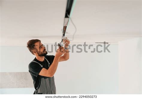Installing Lighting Equipment On Ceiling Man Stock Photo 2294050273 Shutterstock