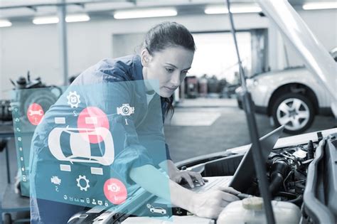 Premium Photo | Engineering interface against mechanic using laptop on car