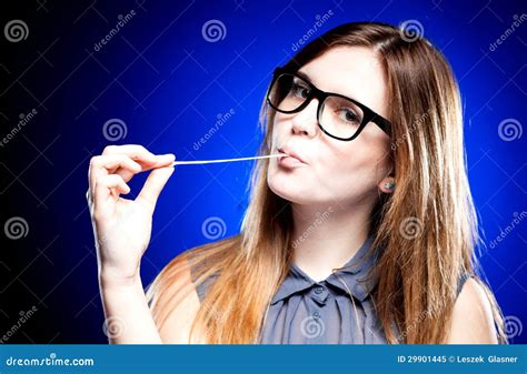 Portrait Of Strict Young Woman With Nerd Glasses And Chewing Gum Stock Image