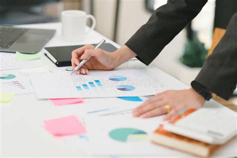 cropped shot of a startup business discussing a graph based business