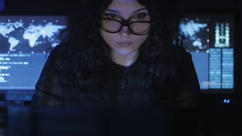Bespectacled Woman Hacker Programmer Is Working On Computer Stock Footage