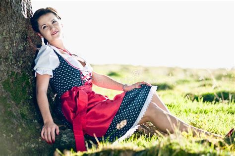 Woman Leaning On A Tree Stock Photo Image Of Cute Dirndl