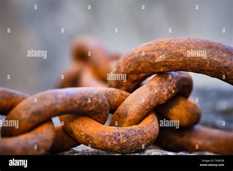 Rusty Big Chain Lying On A Stone Stock Photo Alamy