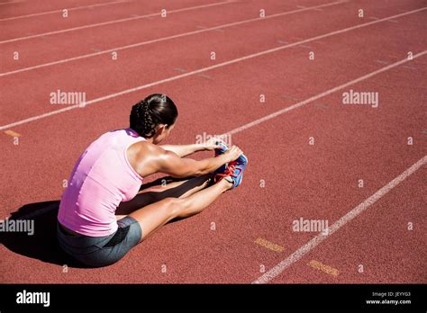 Female Athlete Stretching Her Hamstring Stock Photo Alamy
