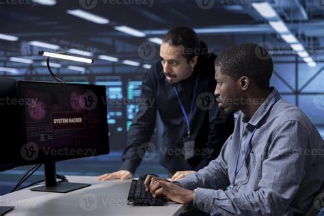 team of developers in server hub trying to protect hardware from hacker