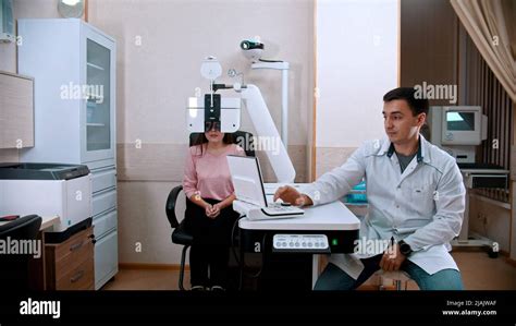 Ophthalmology Treatment Young Woman Checking Her Visual Acuity With An Optometrist Equipment