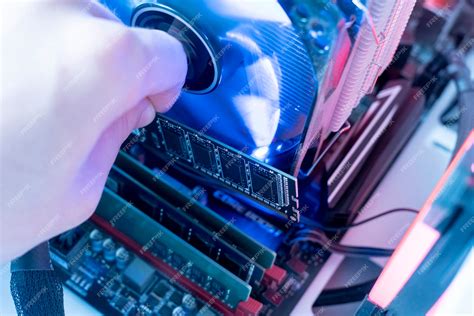 premium photo the inserting plug in the ram ddr memory card in the computer mainboard random
