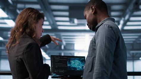 Software Developers In Data Center Using Laptop Employing Ai Machine