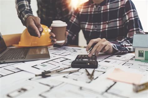 Professional Architect Designer Structural Engineer Team Colleagues Discussing Building Plan
