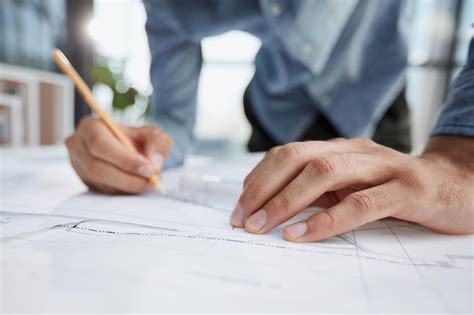 Premium Photo Engineer Designs Works According To Drawings And Collaborates In Structural