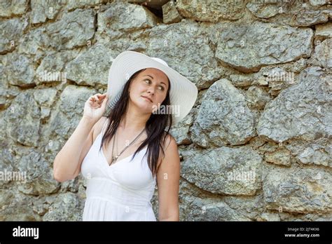 Happy Cute Brunette Woman In Park On Summer Day Cheerful Beautiful Woman In A White Dress And A