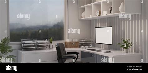 Interior Design Of A Modern White Office Workspace With A Computer