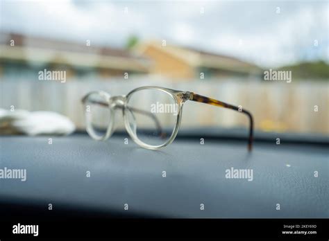 Clear Fashionable Glasses On The Dashboard Of A Car In Australia Stock
