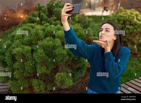 Beautiful Lady Sending Blowing Kiss To Someone By Video Call Stock