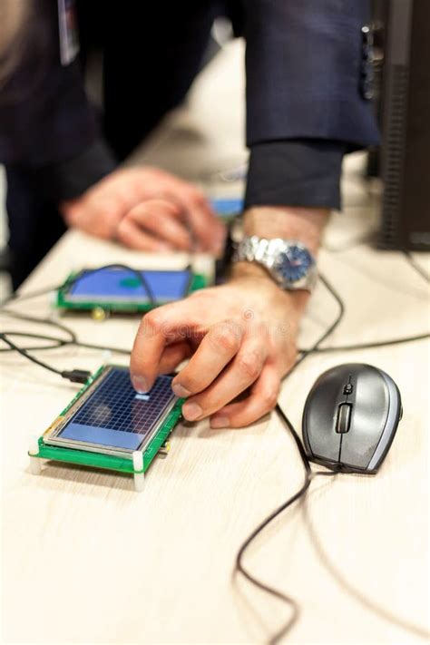 Microcontrollers And A Human Hand `game Of Life` Micro Board