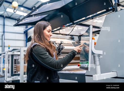 Female Worker Using A Cnc Machine To Control An Industrial Crane Stock Photo Alamy