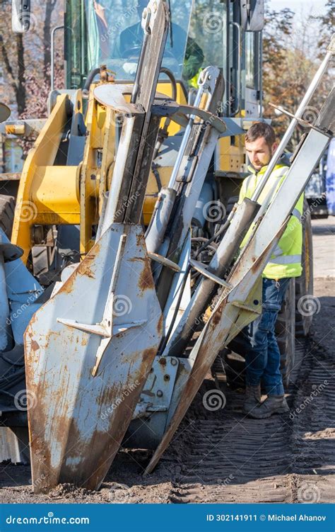 Male Worker Operates Tree Transplanter Heavy Machine Landscaping Seasonal Agricultural