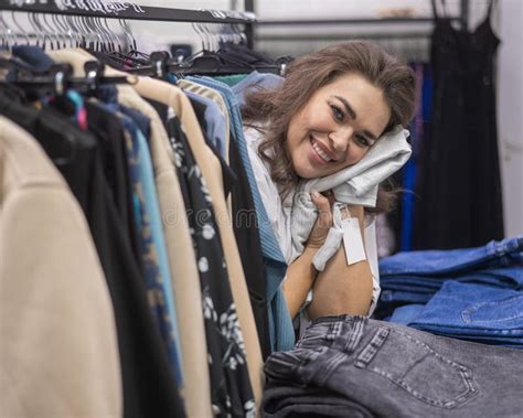A Fat Woman Chooses Clothes In A Plus Size Store Stock Image Image Of Mall Armful 326961251