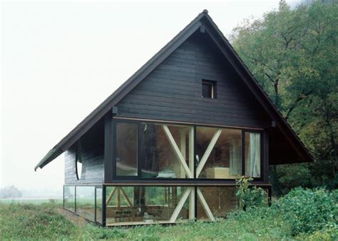 Swiss House By Pascal Flammer With Wooden Braces And A Circular Window