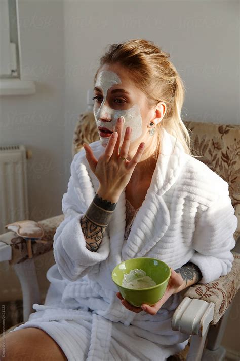 Female Smearing Mask From Bowl By Stocksy Contributor Danil Nevsky Stocksy