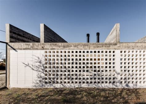 House By Tectum Features Raw Concrete Walls And Black Metal